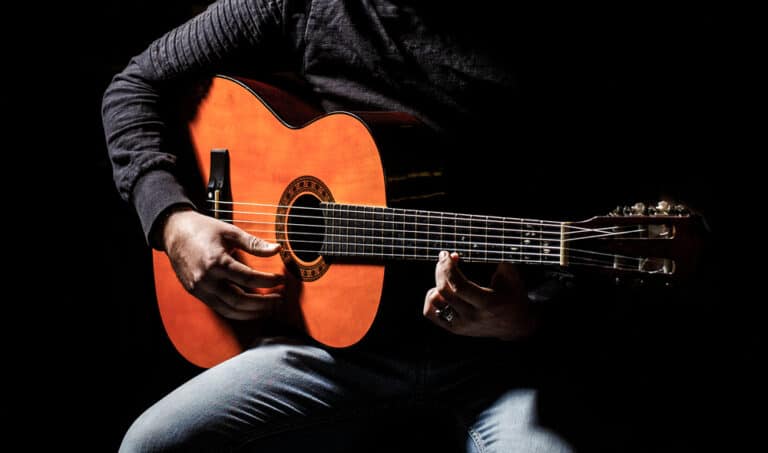 Which Hand Do You Strum a Guitar With? (Ultimate Guide) | InstrumentGuys